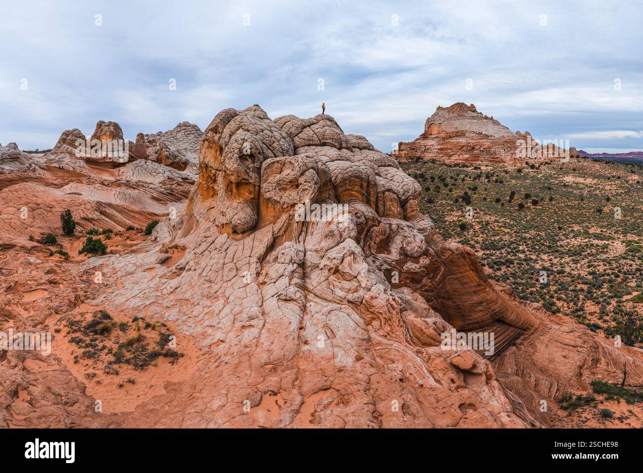 Unrecognizable person standing on a unique rock formation at White ...