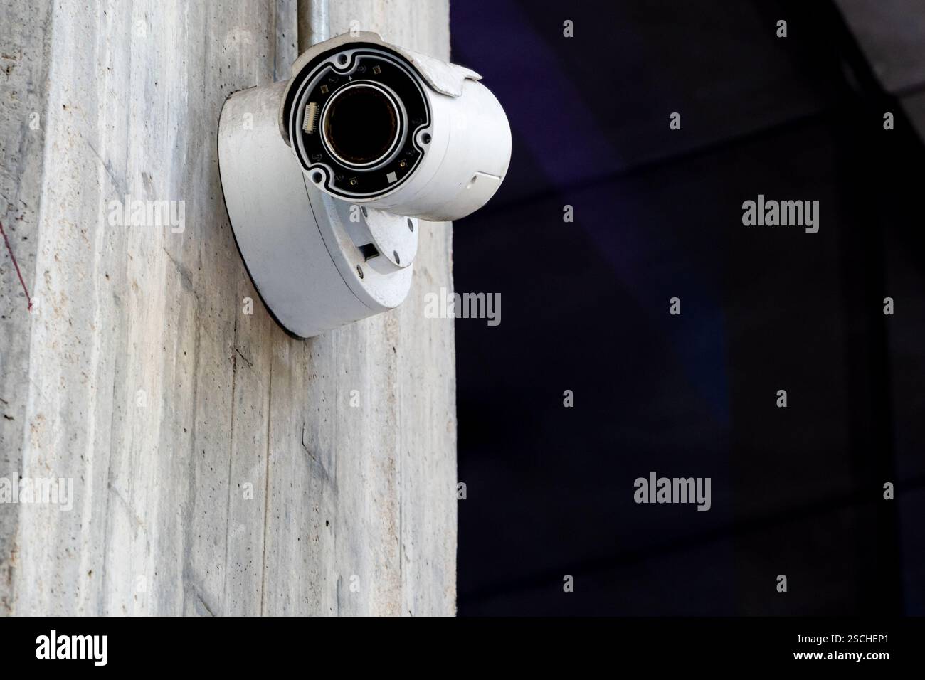 This image features a modern outdoor surveillance camera securely ...