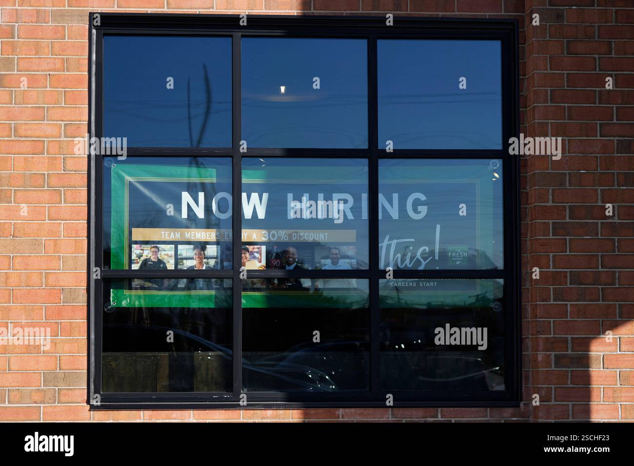 Hiring sign is displayed at a grocery store in Northbrook, Ill ...