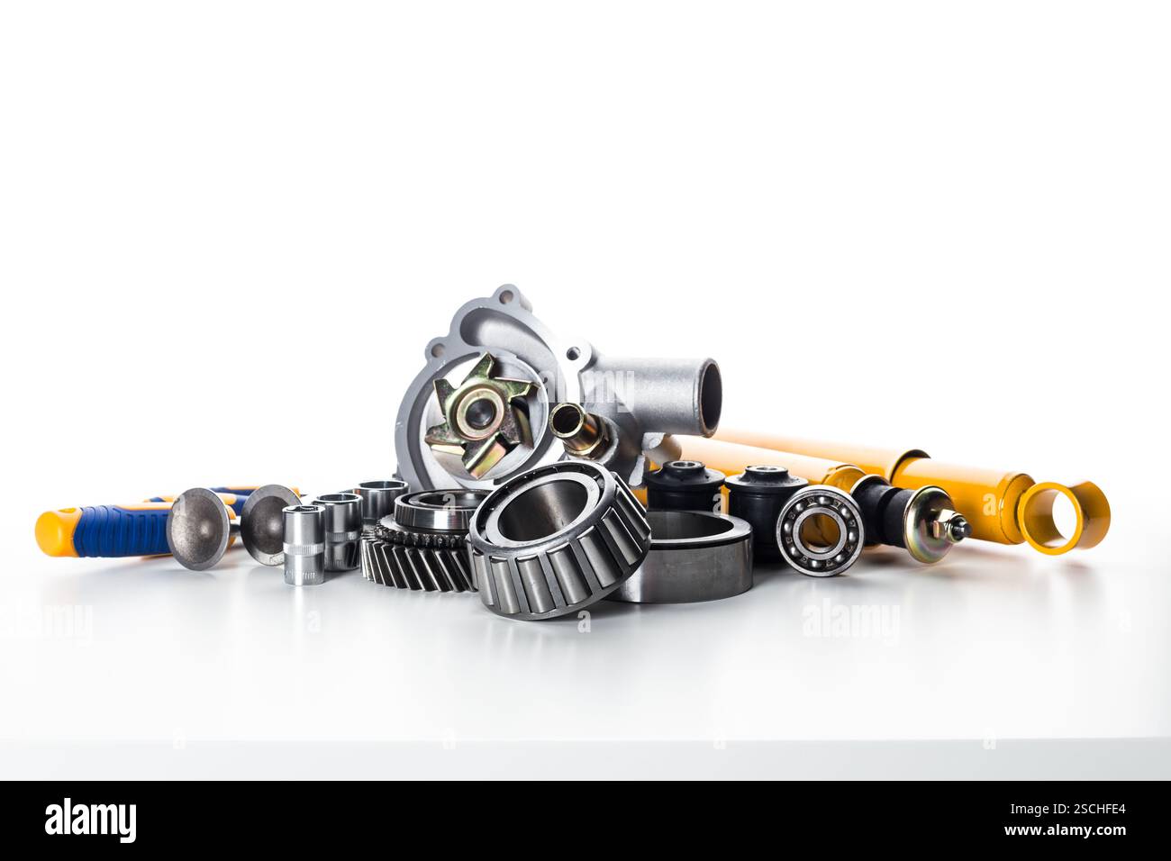 Engine parts and components arranged neatly on a work surface for ...