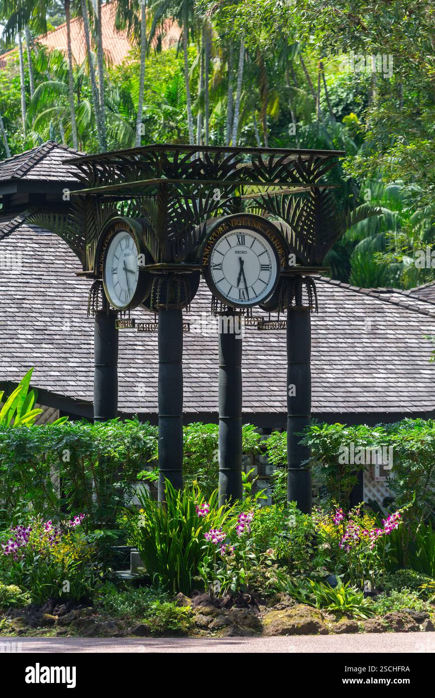 Vertical view of four faced clock tower sculpture at Singapore Botanic ...