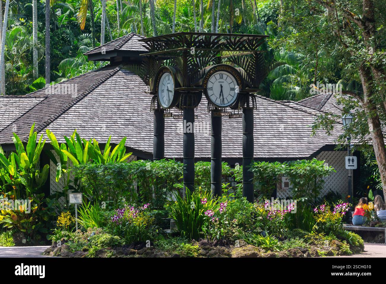 Four faced clock tower sculpture at Singapore Botanic Gardens. Outside ...