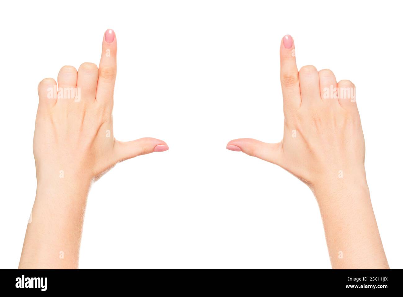 Hands forming a frame gesture with fingers extended, ready to capture a ...