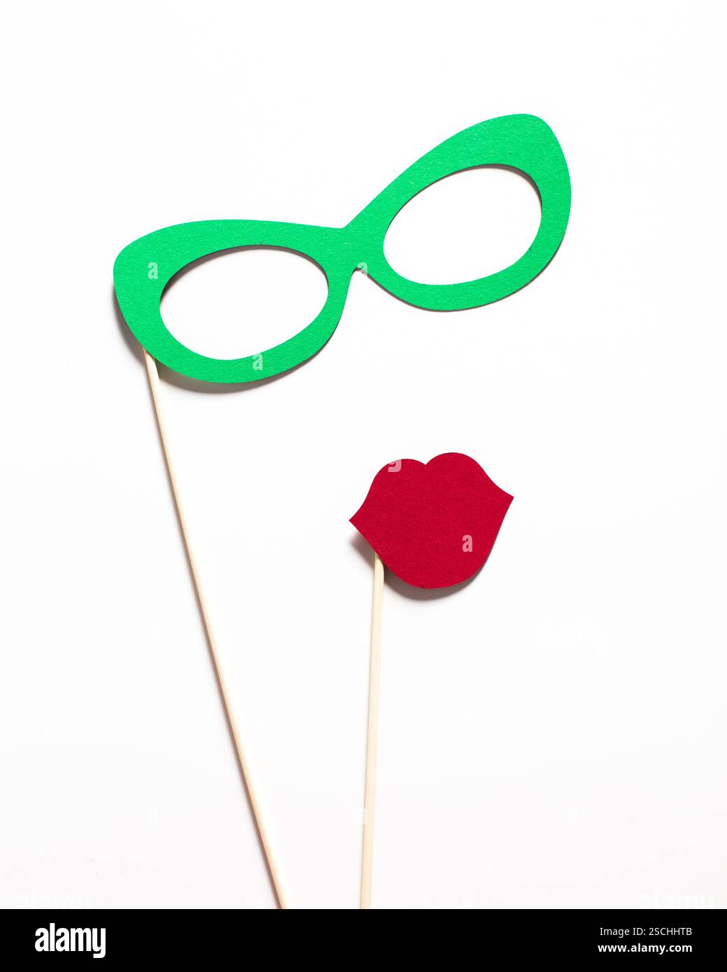 Props for a fun photo booth backdrop featuring green glasses and red ...