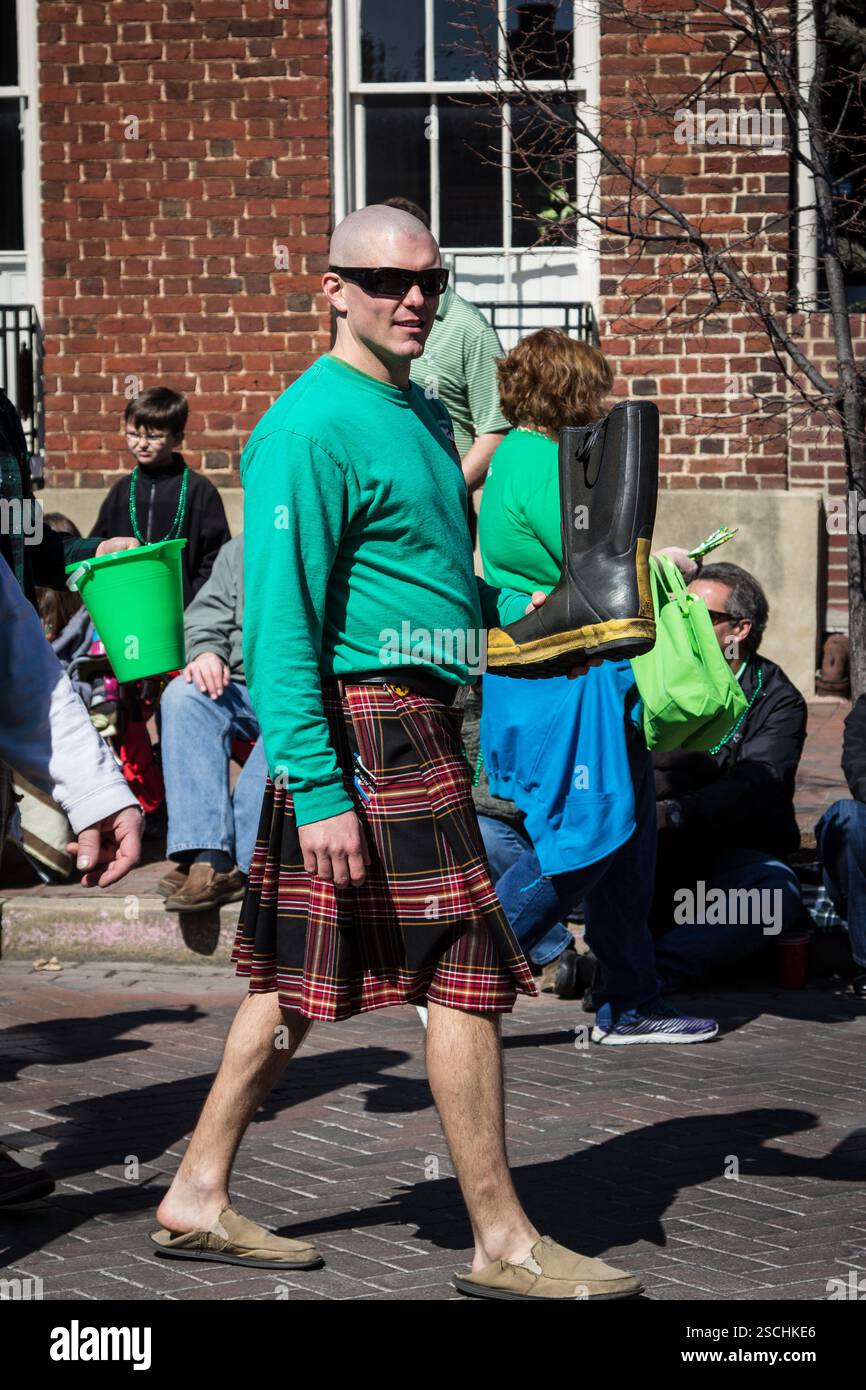 Man in kilt, St. Patrick's Day parade, handing out green buckets Stock ...