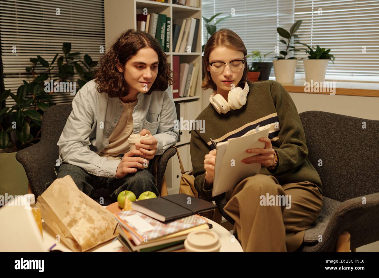 Two Students Sharing Notes Stock Photo - Alamy