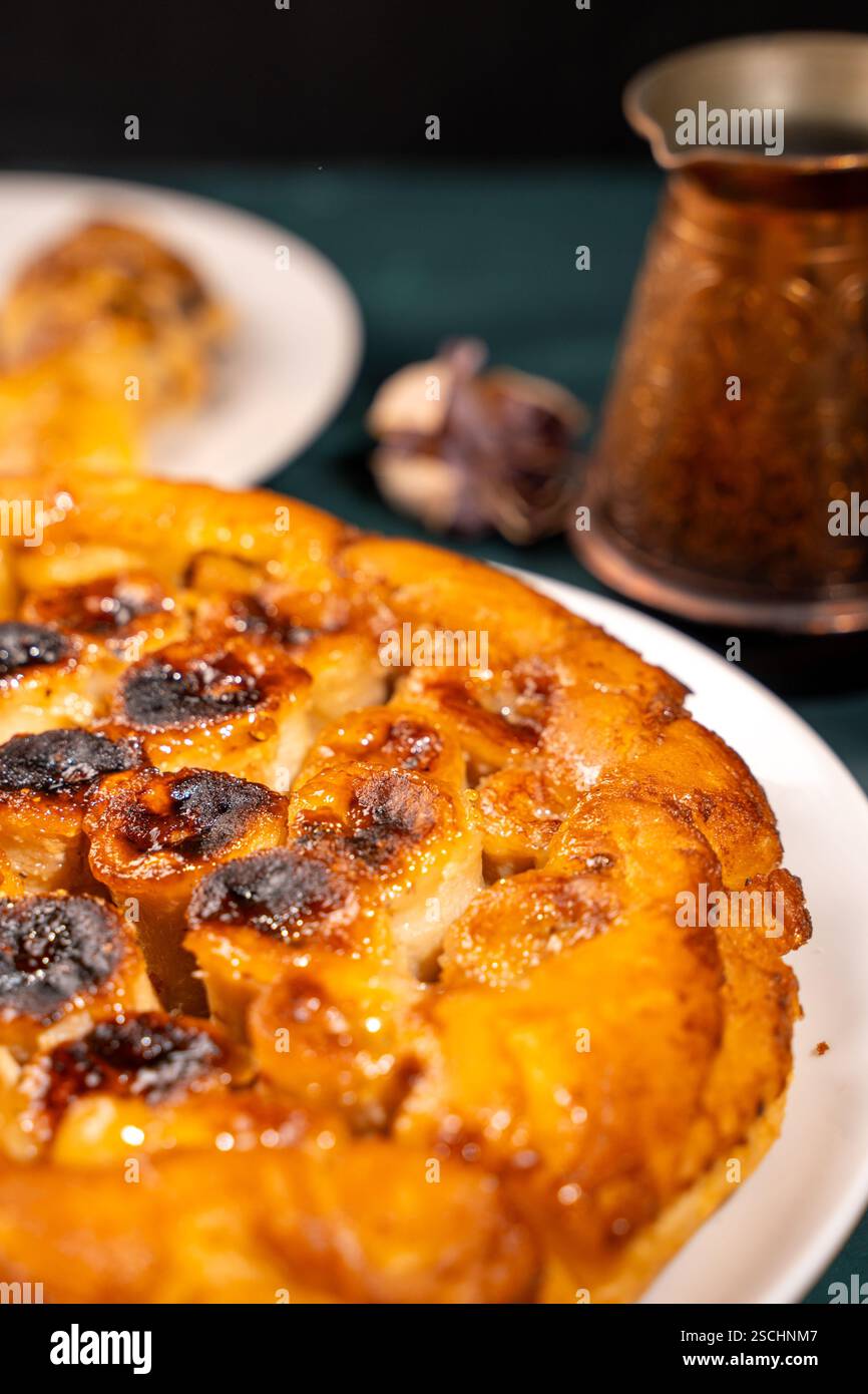 Traditional homemade banana caramel pie. French Tarte Tatin on a white ...
