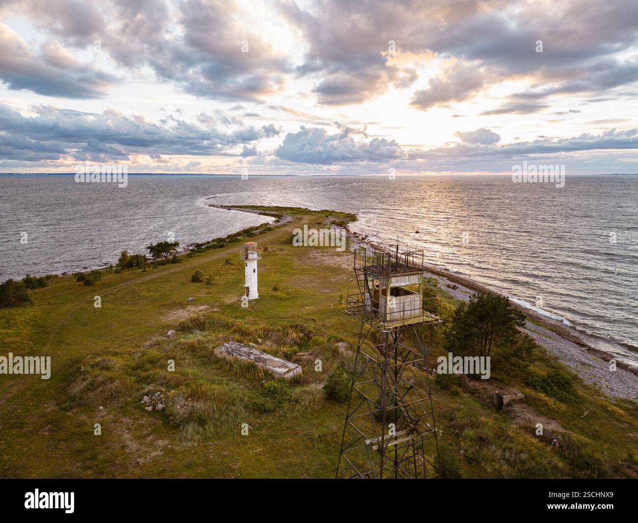 Dramatic sunset over an abandoned lighthouse and watchtower on the ...