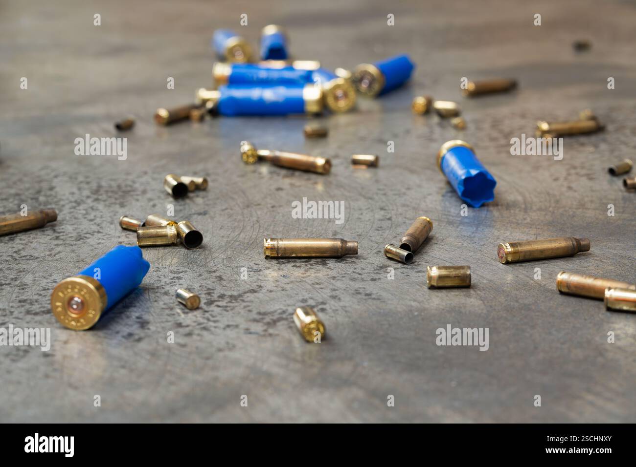 Shotgun, pistol and rifle shells at a shooting range. Close-up photo ...