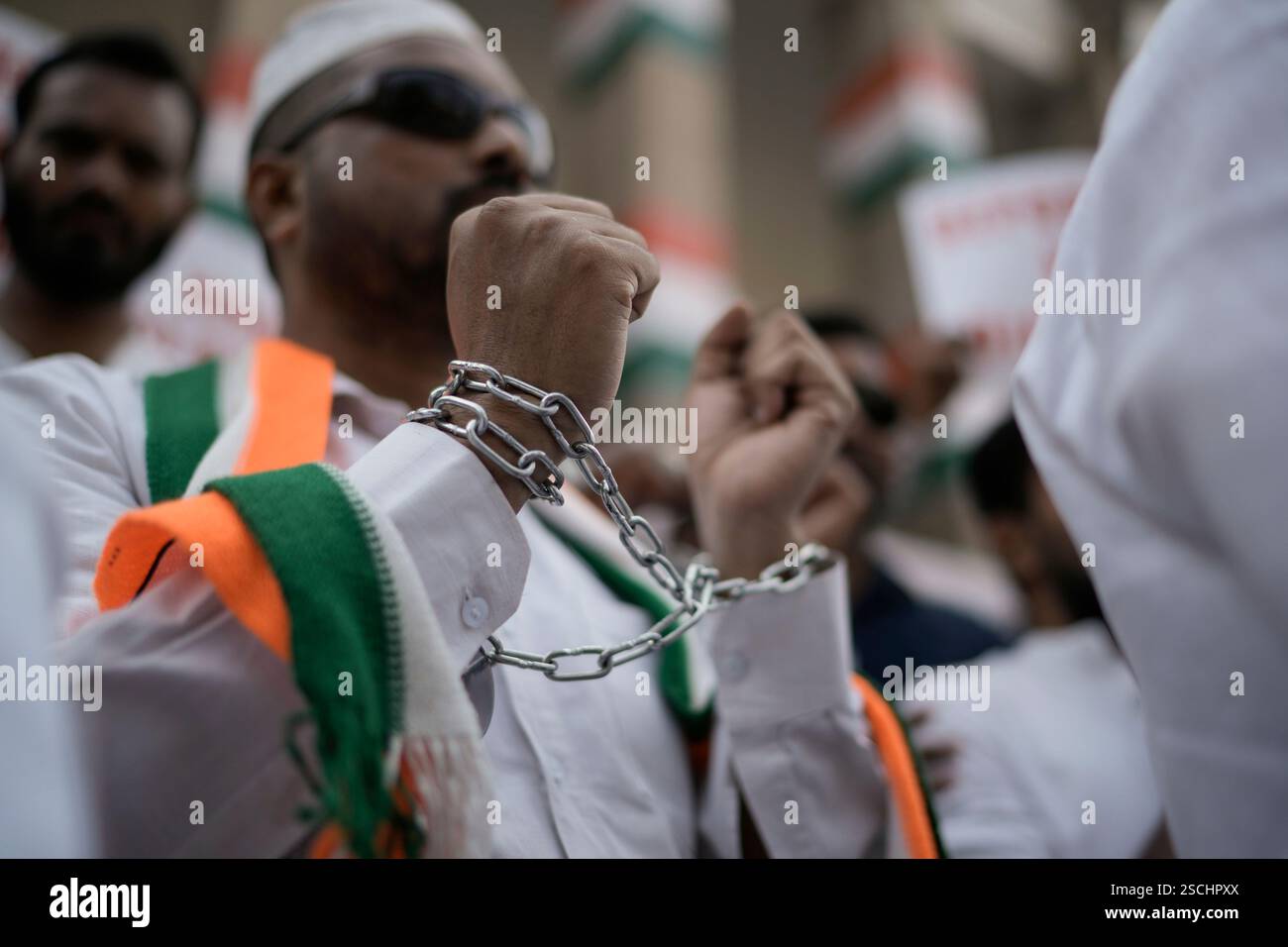 Congress party worker wearing shackles, protest to condemn the reported ...