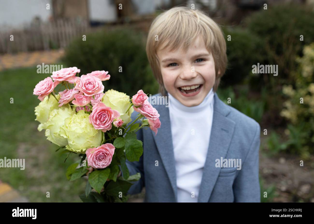Boy holding bunch of roses hi-res stock photography and images - Alamy