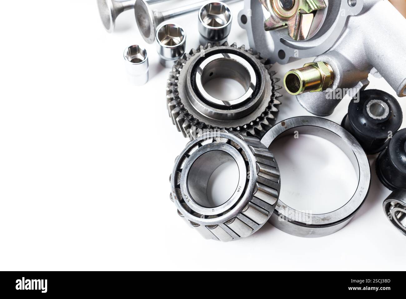 Collection of automotive parts arranged on a white surface for ...