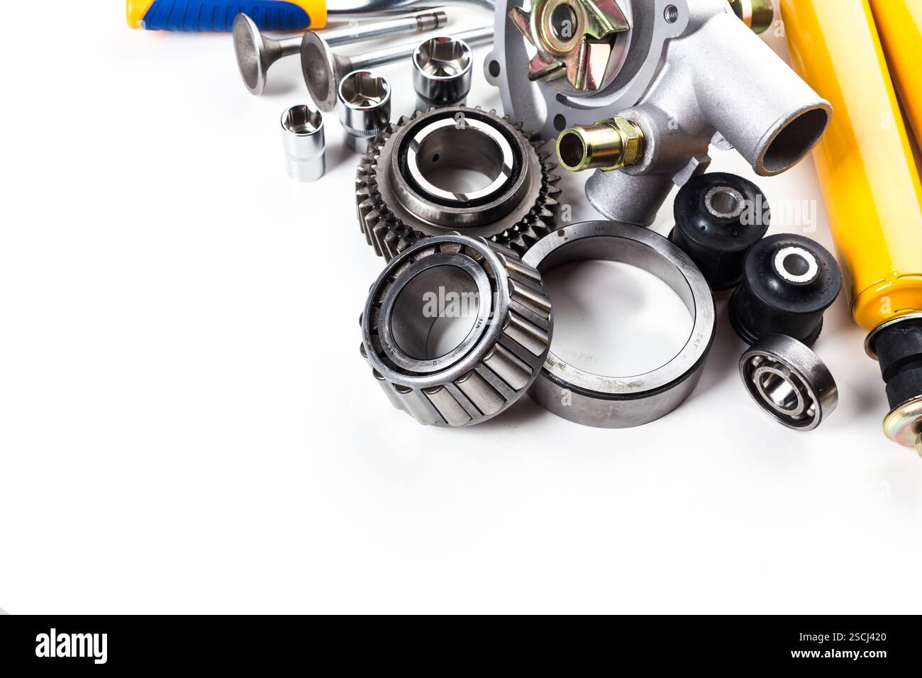 Collection of automotive parts displayed on a clean surface showcasing ...
