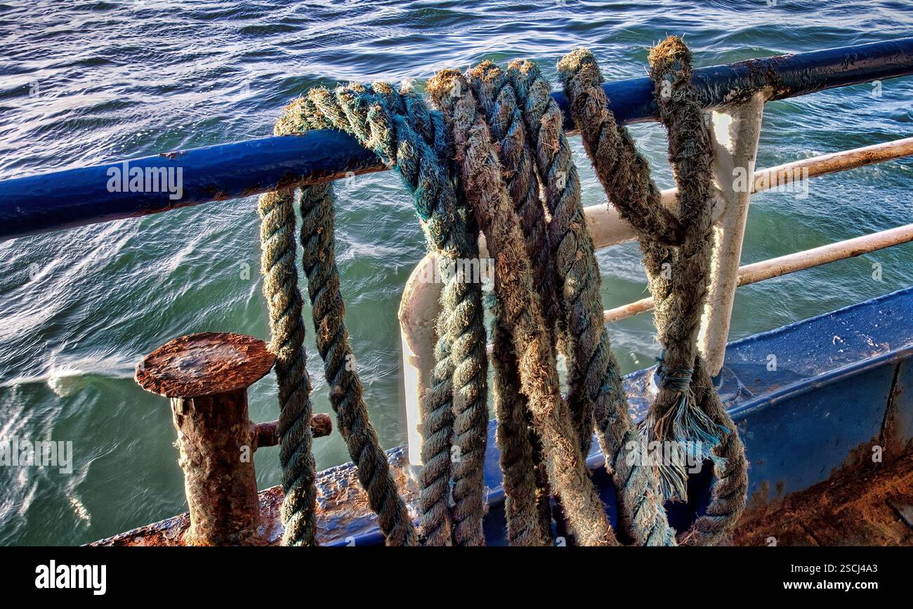 Mooring rope on the side railing of an old ferry boat Stock Photo - Alamy