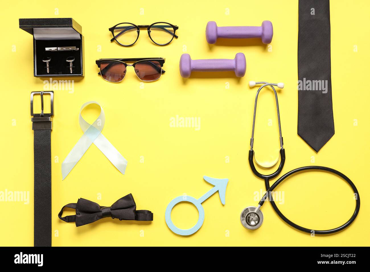 Stethoscope, tie, belt, male sign and light blue ribbon on yellow ...