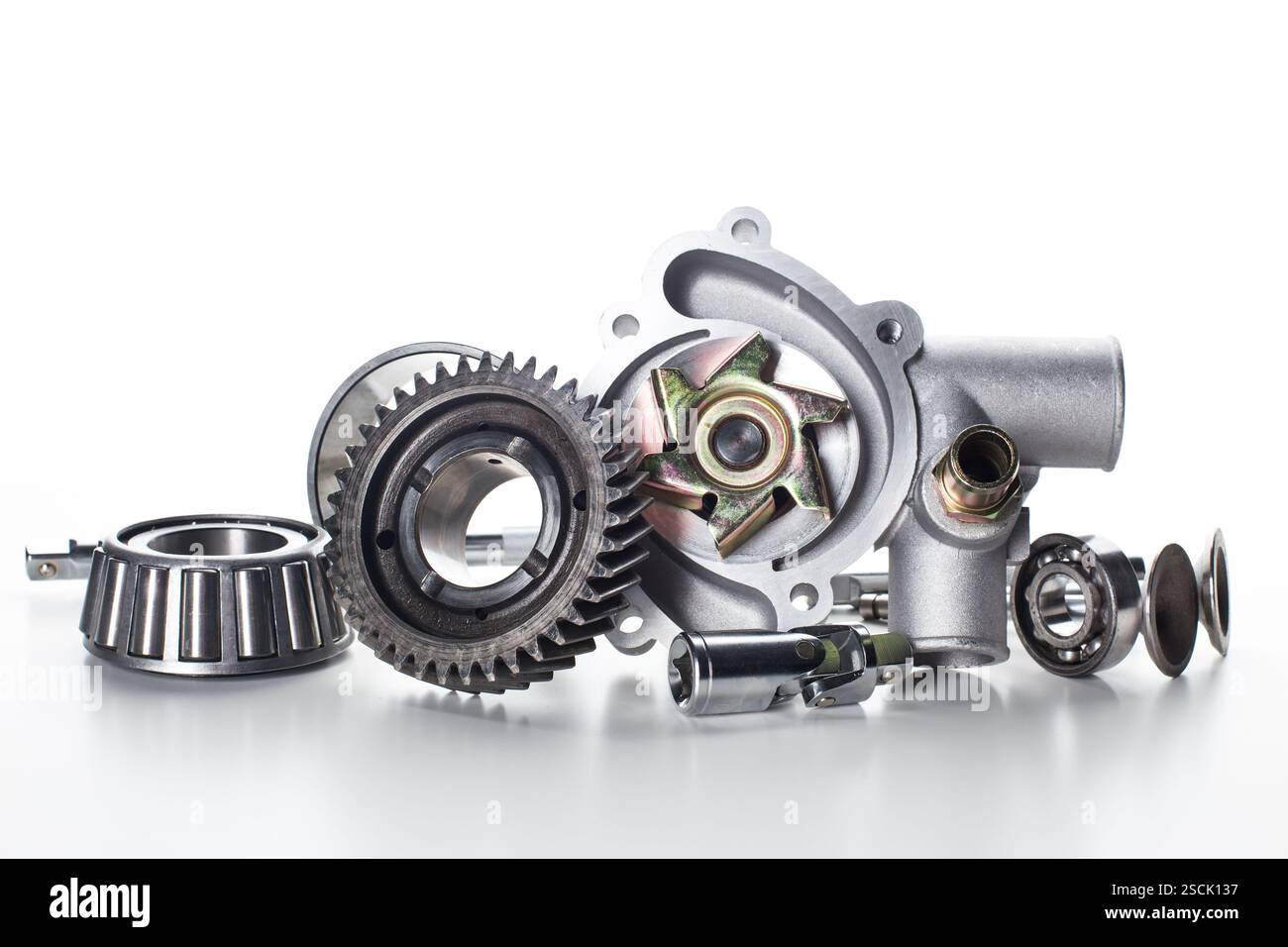 Collection of automotive mechanical components displayed artfully on a ...