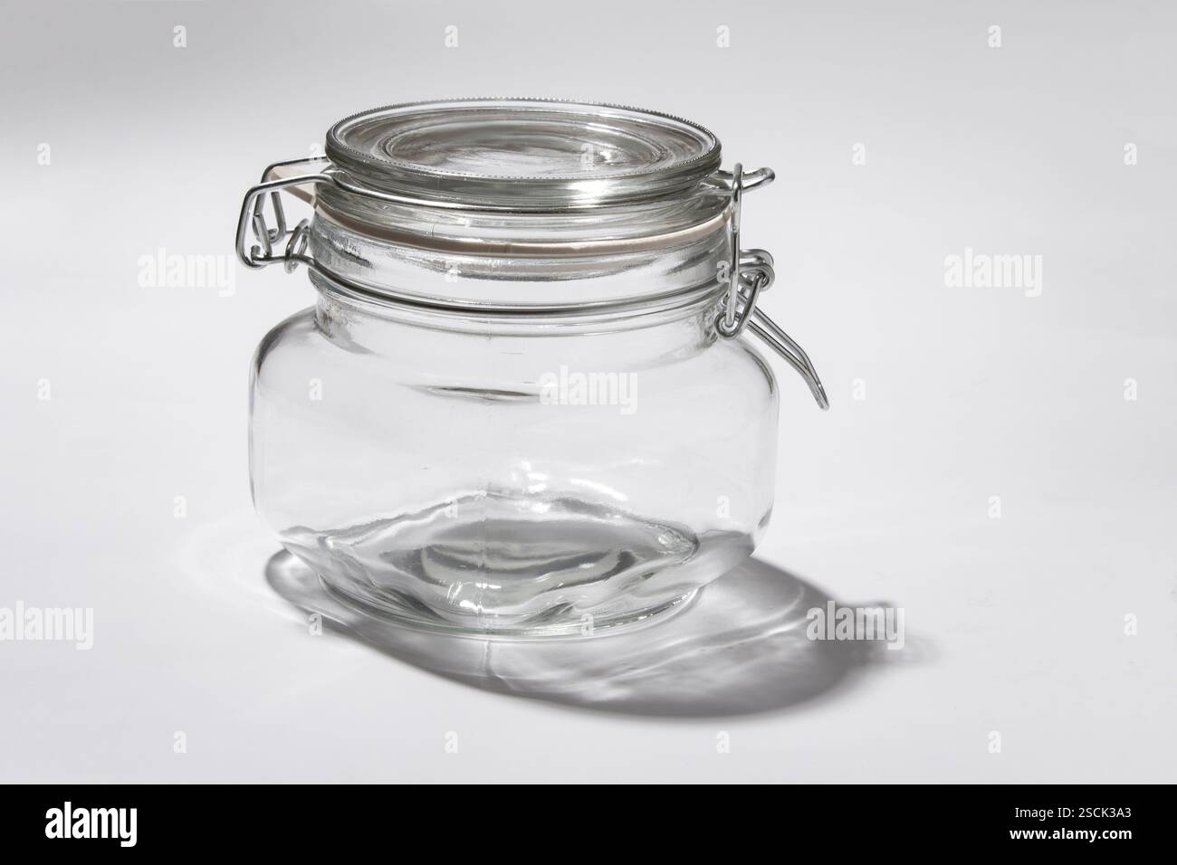 an empty glass jar on white background Stock Photo - Alamy