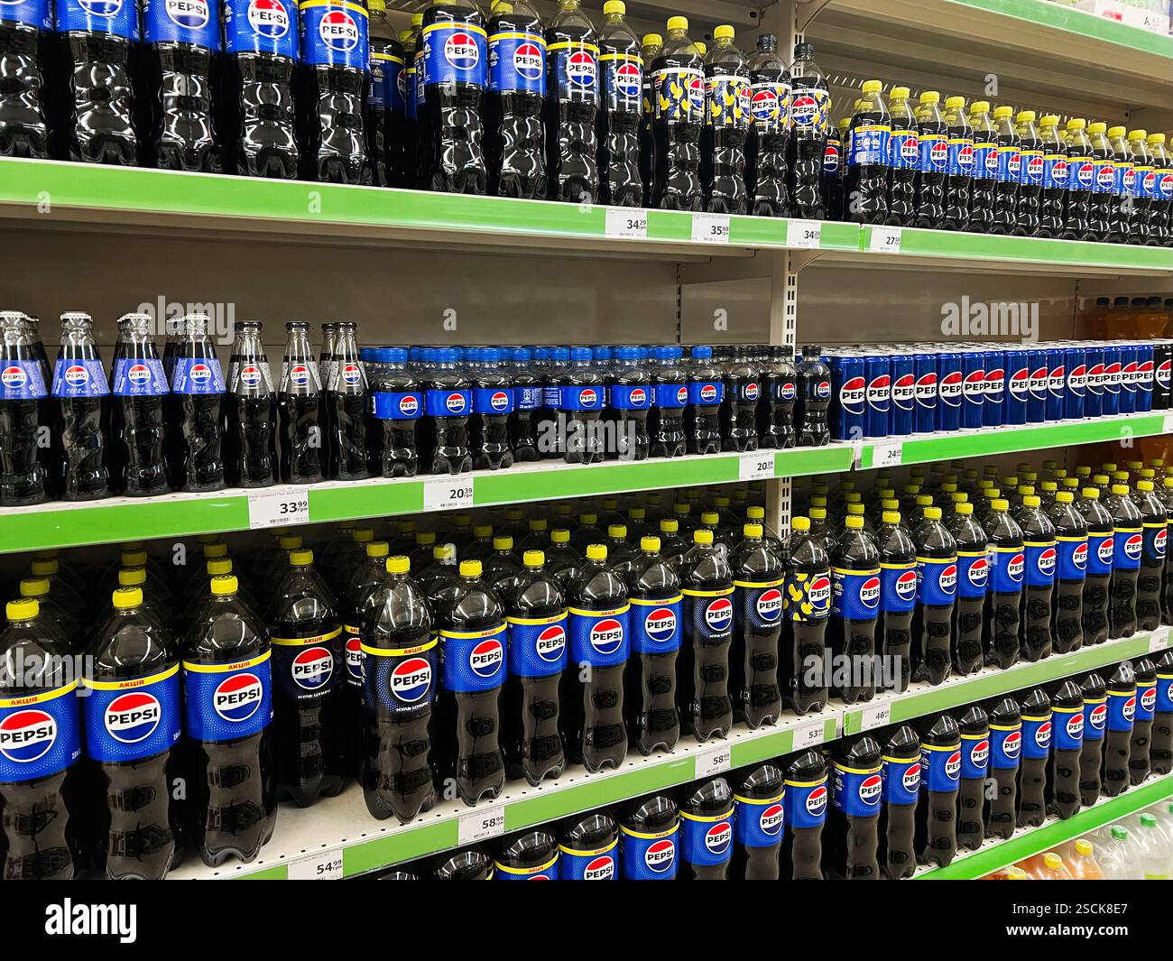 Kyiv, Ukraine - February 04, 2025: Rows of Pepsi soft drink bottles ...