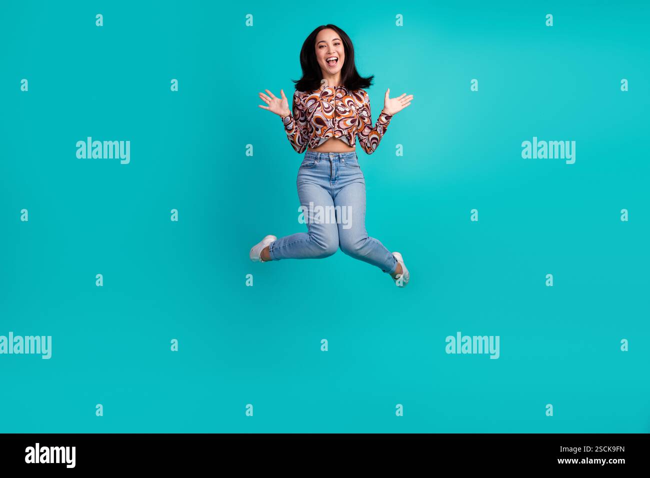 Full size photo of pretty young woman jump rejoice isolated on teal ...