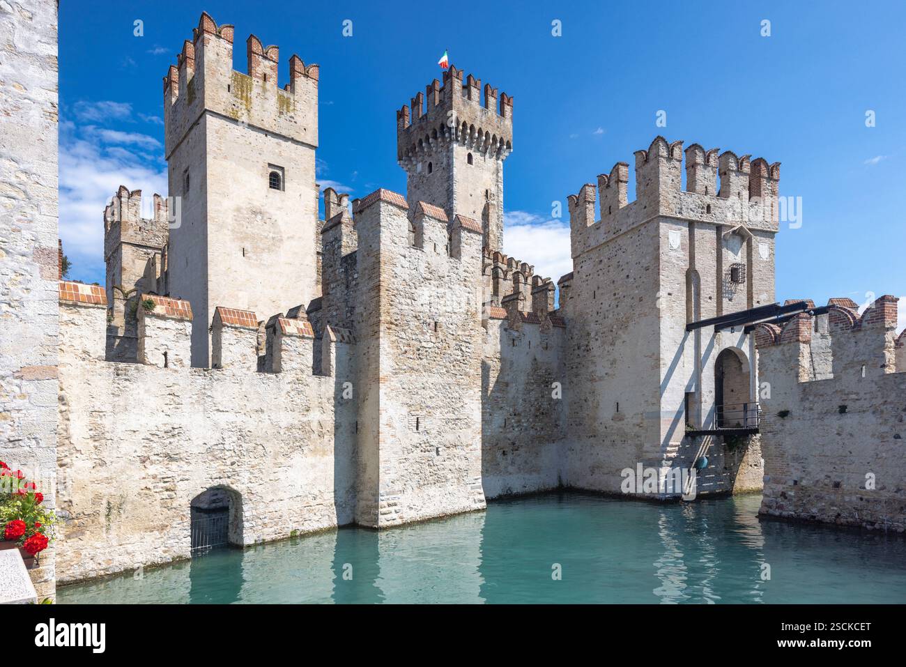 An impressive medieval castle with towering stone walls, fortified ...