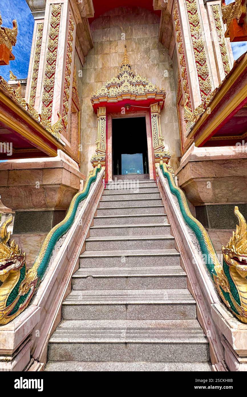 Majestic Entrance of a Buddhist Temple A grand staircase leading to the ...