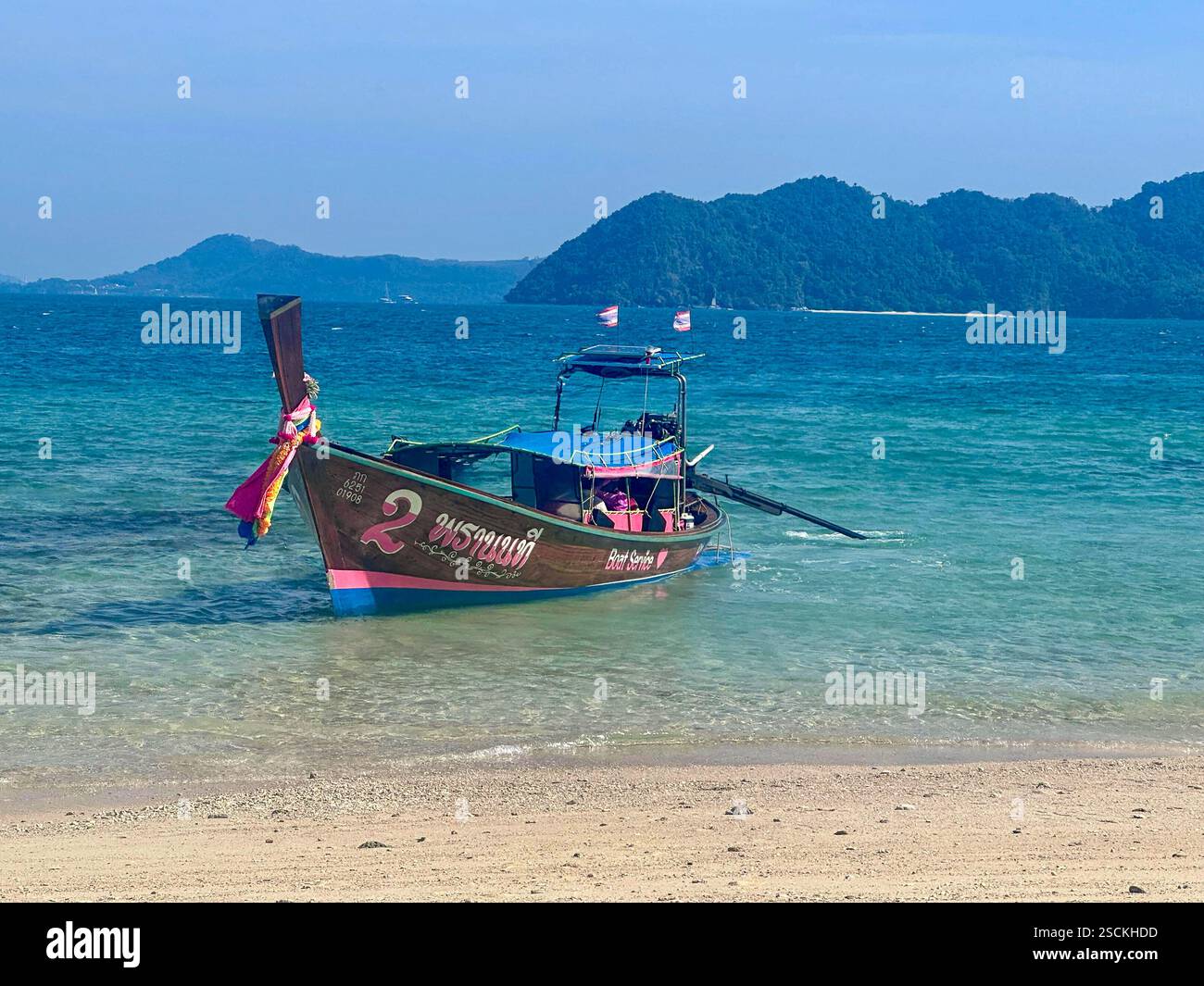 Long Tail Boat on the Turquoise Waters of the Andaman Sea A traditional ...