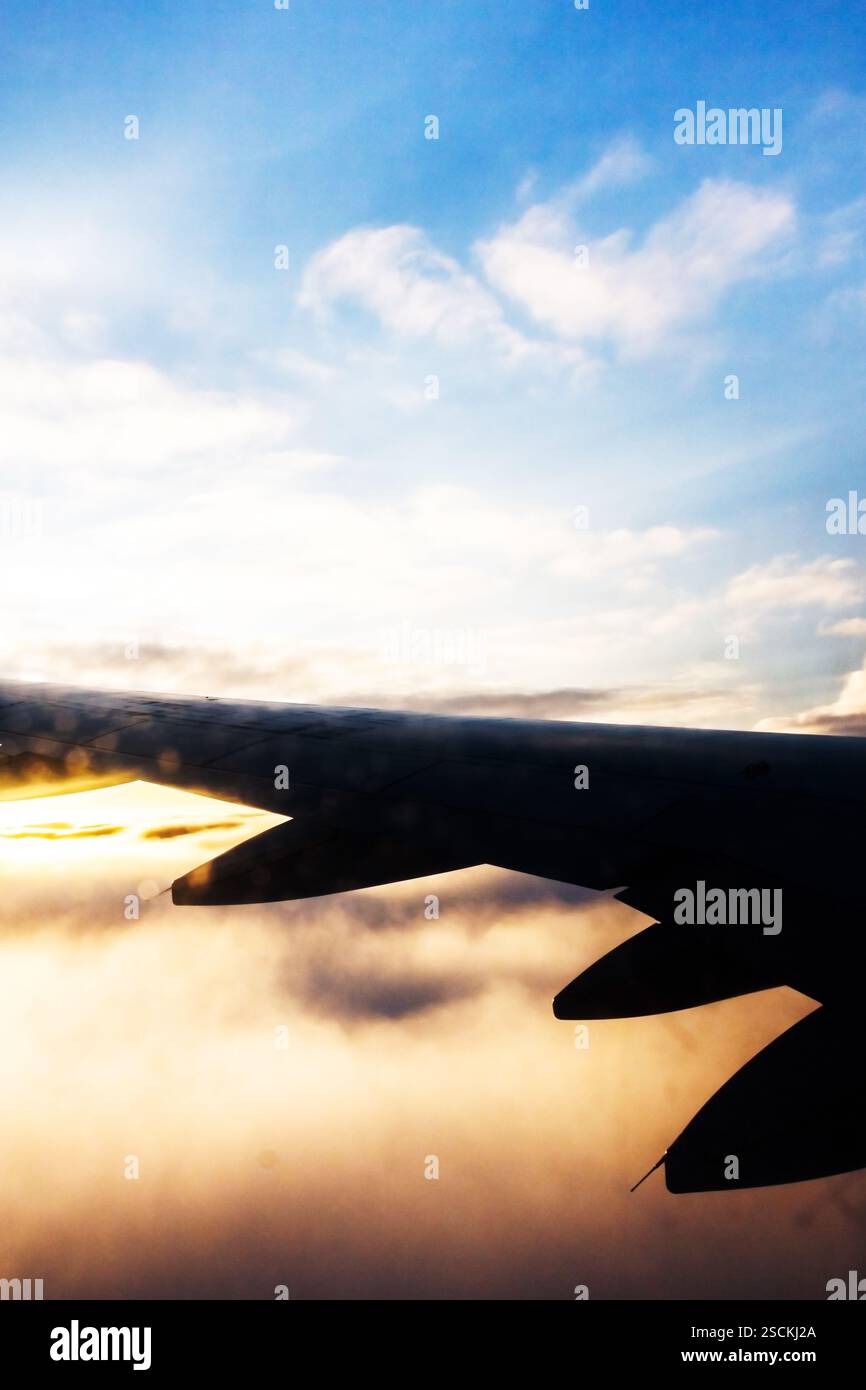 Capturing the serene beauty of sunset viewed from an airplane wing ...