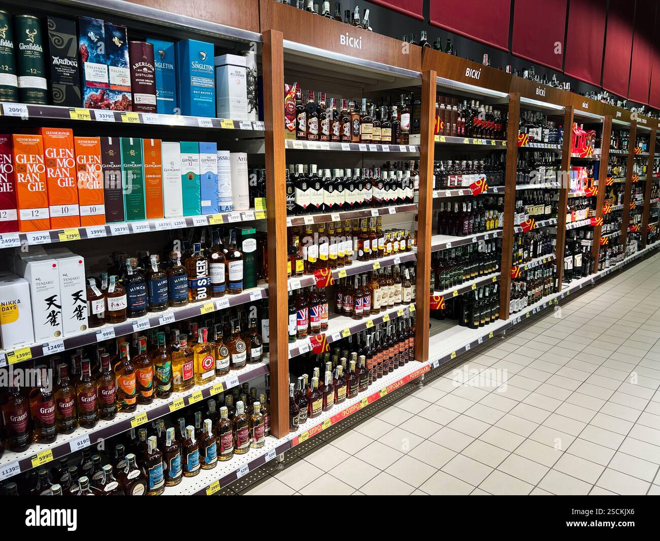 Kyiv, Ukraine - February 04, 2025: Wide aisle view of diverse alcoholic ...