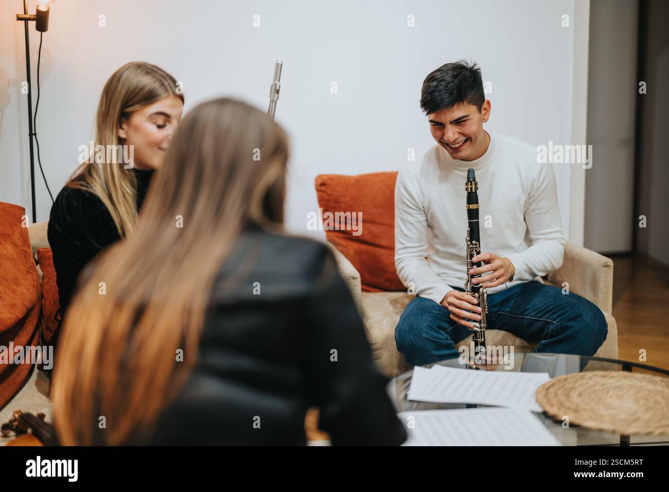 Group of friends enjoying their time playing and practicing musical ...