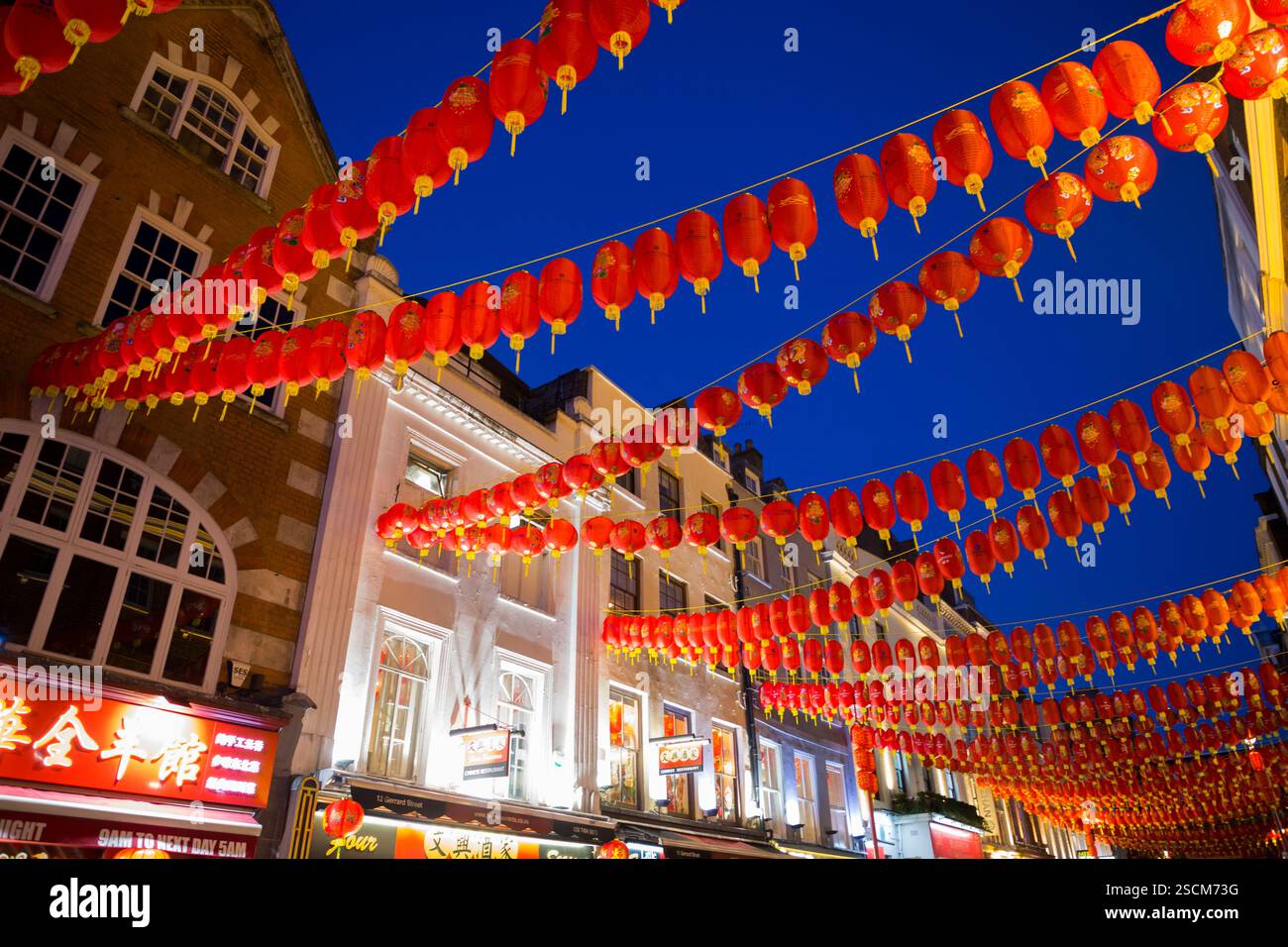 Chinese lanterns decorate Chinatown Gerrard Street / roads streets for Chinese New Year ...