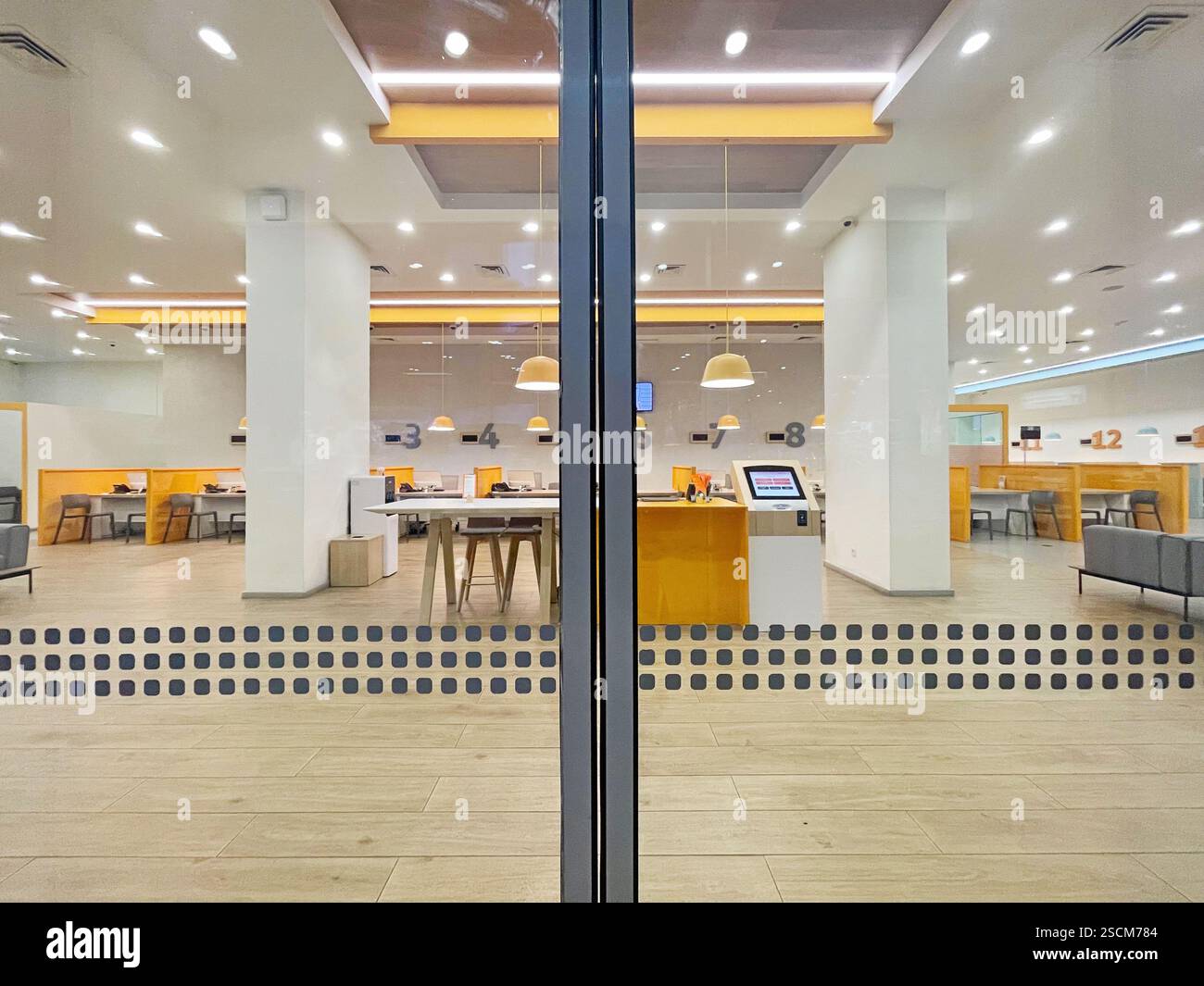 Closed glass door of modern bank. Banking equipment, reception office ...