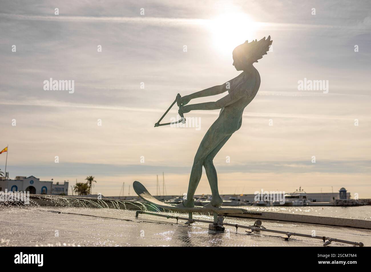 Bronze dynamic surfer La Venus statue with beach and boulevard real ...