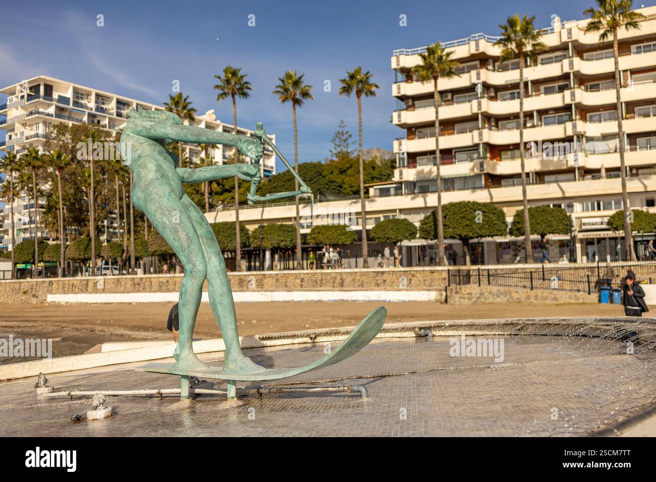 Bronze dynamic surfer La Venus statue with beach and boulevard real ...