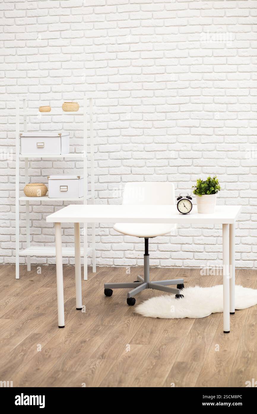 Simple and modern home office setup with white desk, chair, and decor ...