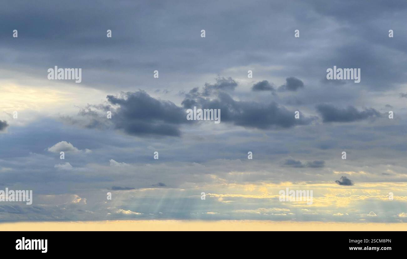 Cloudy sky after rain storm. Sun light on sky Stock Photo - Alamy