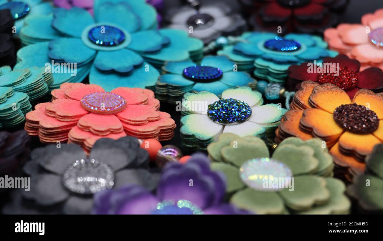 multi-coloured felt flower background with glitter button, spring-like ...