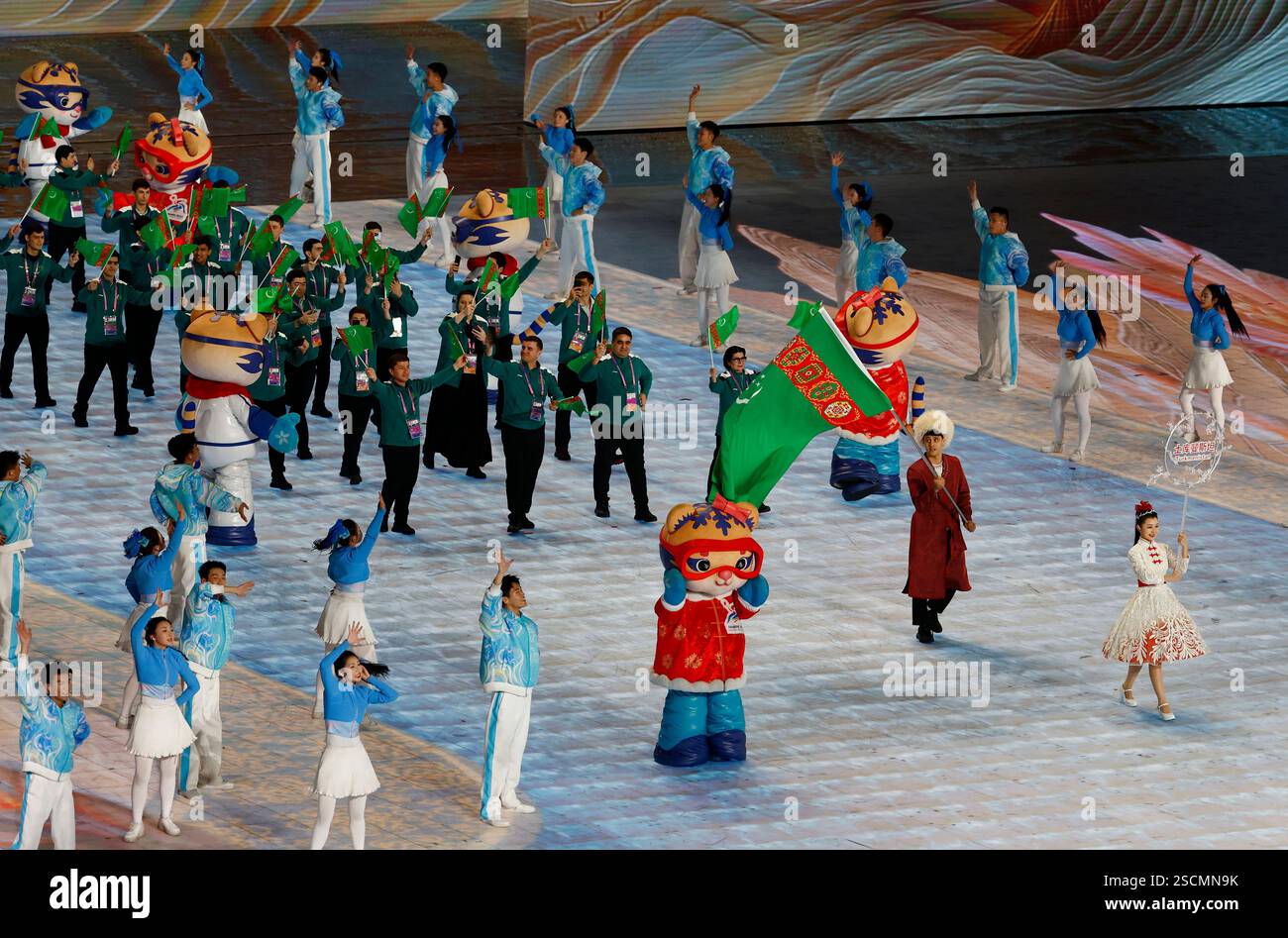 Turkmenistan's flag bearers lead their contingent during the parade of ...