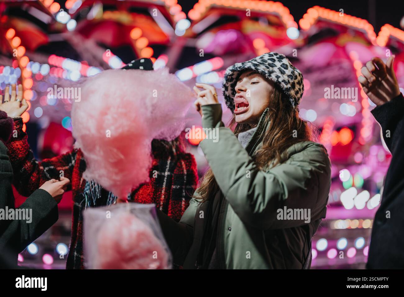 Woman Enjoying Candy Floss at a Nighttime Festival Event Stock Photo ...