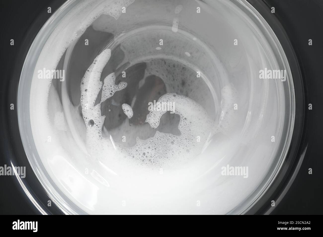Washing machine with suds as background, closeup Stock Photo - Alamy