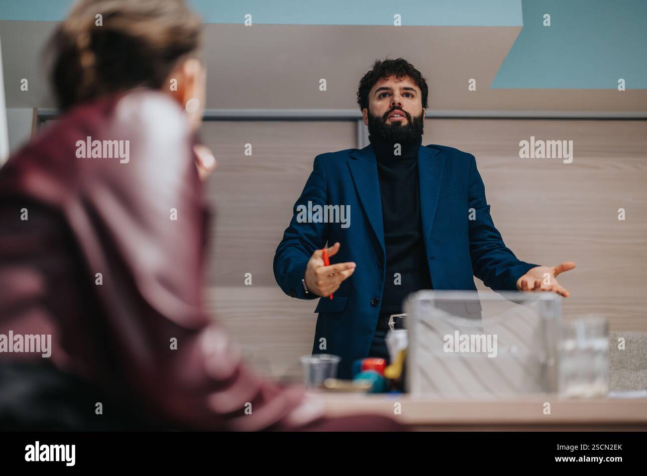 Professional business discussion in modern office with expressive ...
