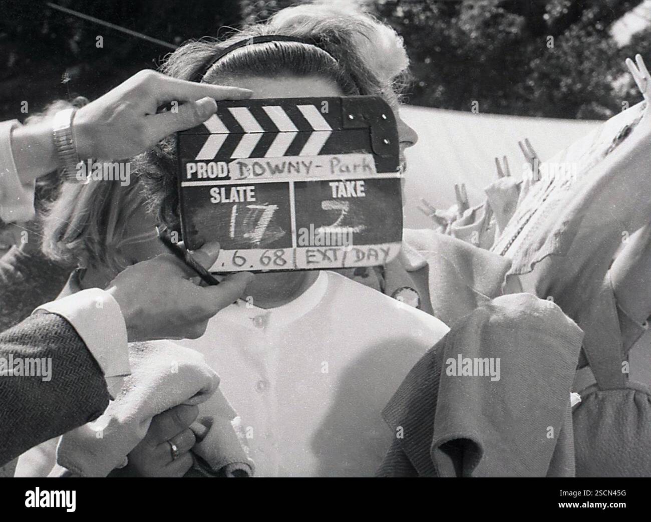 1968, historical, a clapperboard infront of the face of an actress in ...