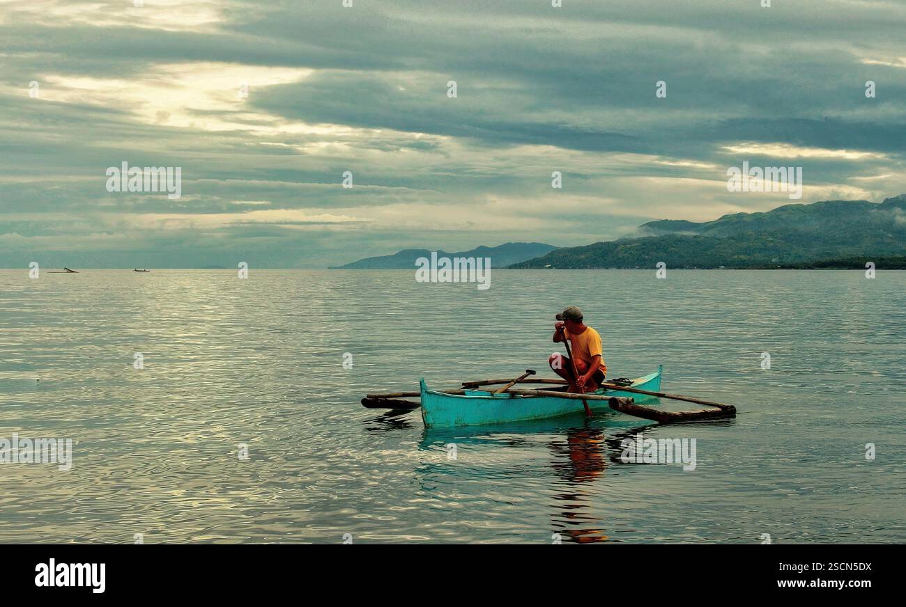 Rowboat with outriggers hi-res stock photography and images - Alamy
