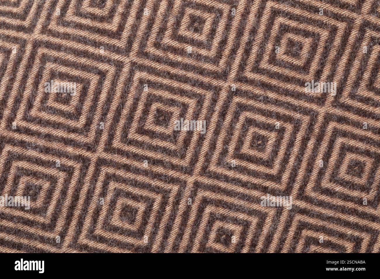 The wool plaid texture features a detailed geometric pattern ...