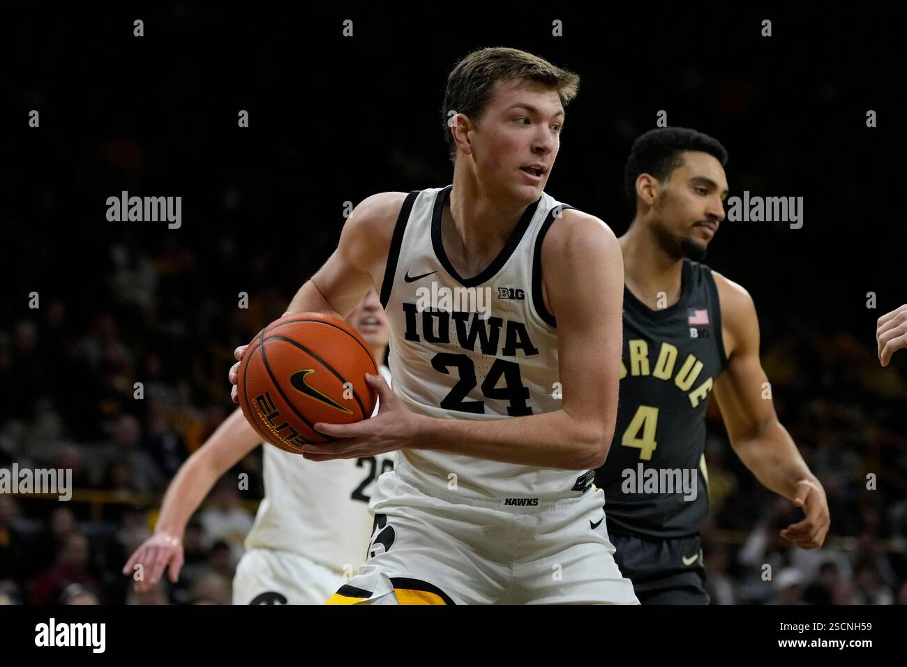 Iowa forward Pryce Sandfort (24) grabs a rebound during the first half ...