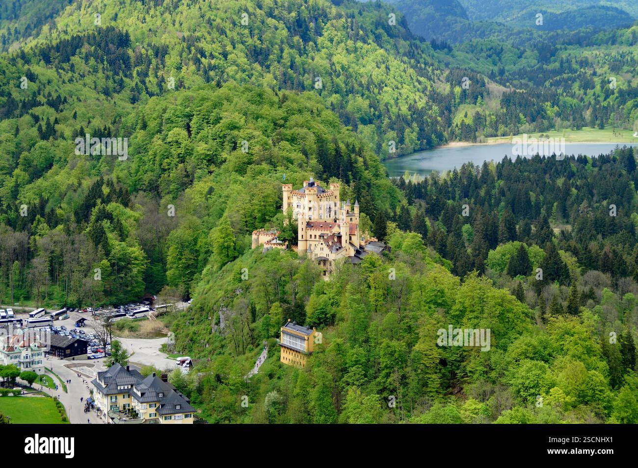 Hohenschwangau Castle in the Bavarian Alps surrounded by the woods and ...