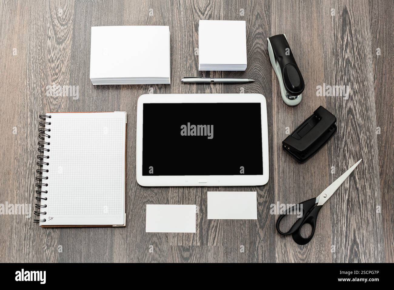 Workstation setup with tablet, notepad, stationery, and organizational ...