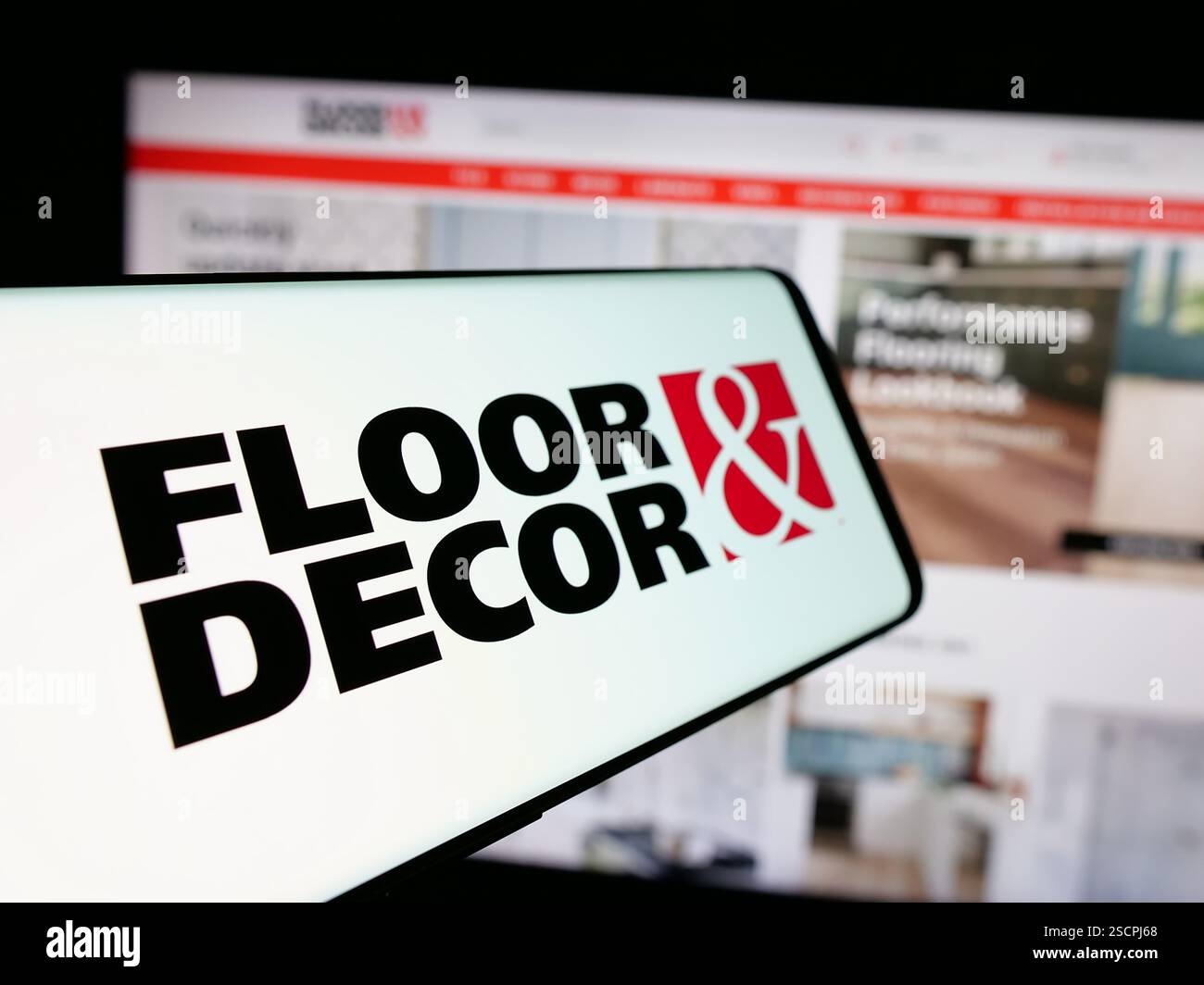 In this photo illustration, a mobile phone with the logo of US flooring ...