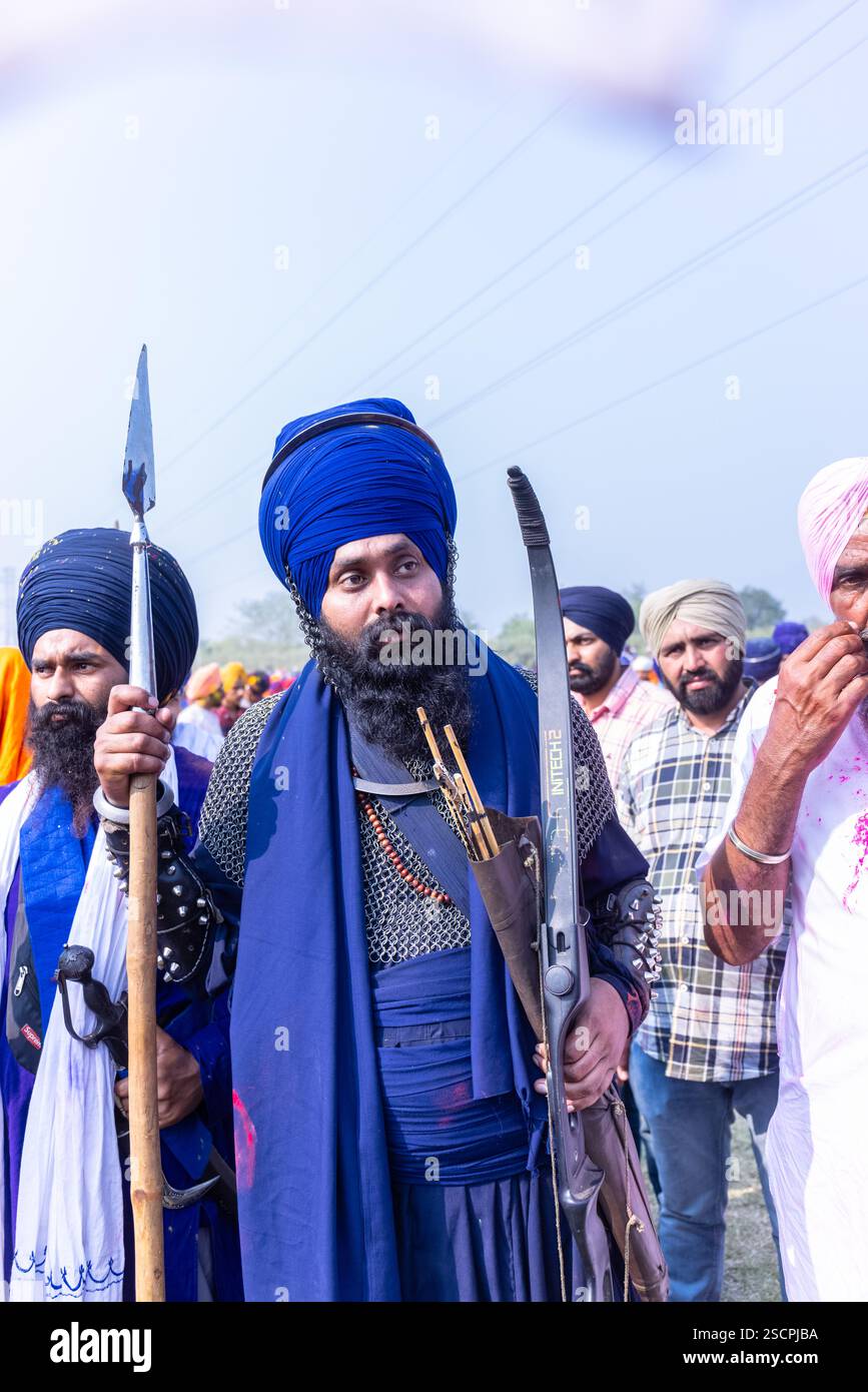 Group of sikh people (Nihang Sardar) performing martial arts during the ...