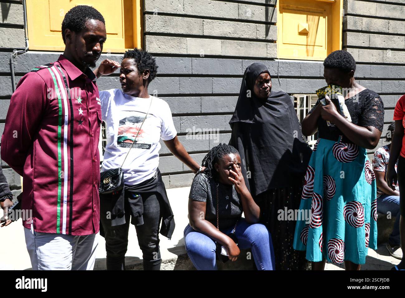 Nakuru, Kenya. 6th Feb, 2025. Alvy Okello (C) wife of missing fisherman ...