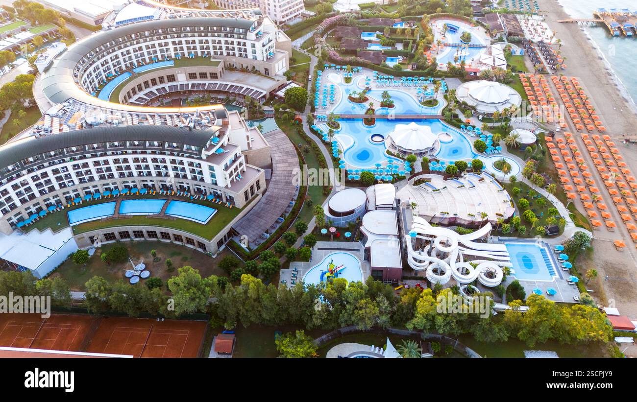 Aerial view of a beachfront luxury resort with modern architecture ...